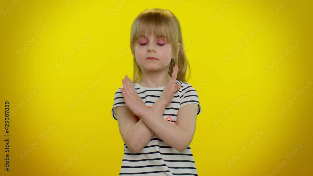 Vidéo Stock Little child kid girl say no hold palm folded crossed hands ...