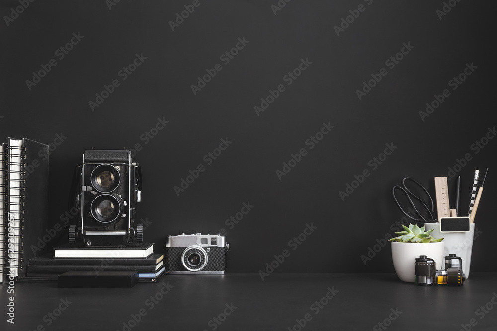 Table with camera, office supplies, plant and space for mockup. Home ...