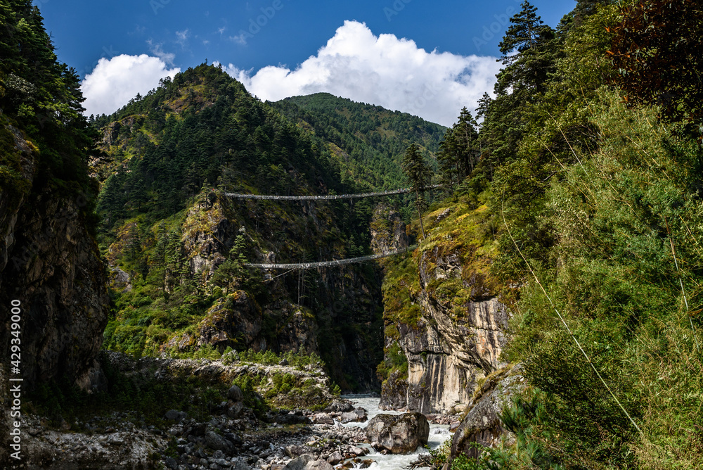 Double traditional suspension bridge in the Himalayas along Mount ...