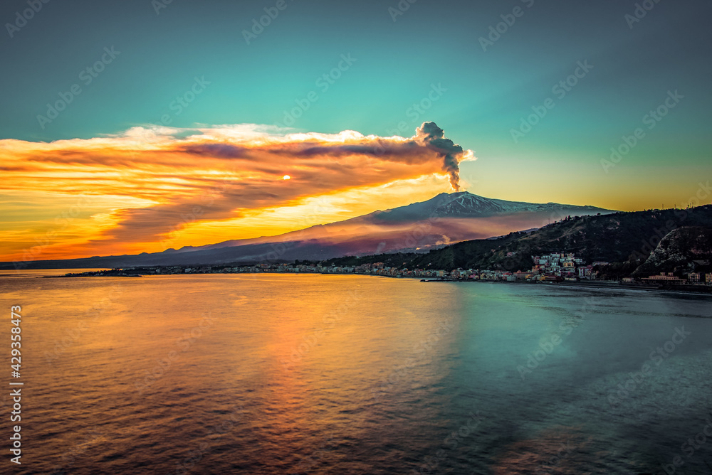Epic eruption of Mt Etna during sunset. Volcanic eruption by the sea ...