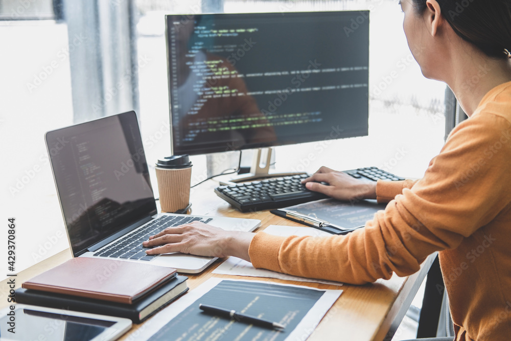 Young Professional programmer working at developing programming and website working in a ...