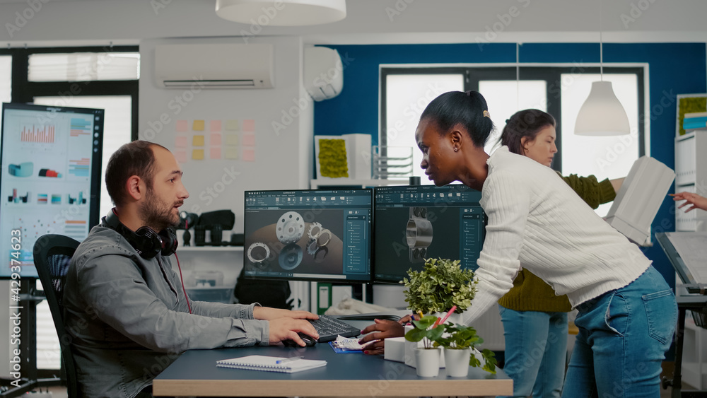 African project manager coming at technician designer discussing about ...