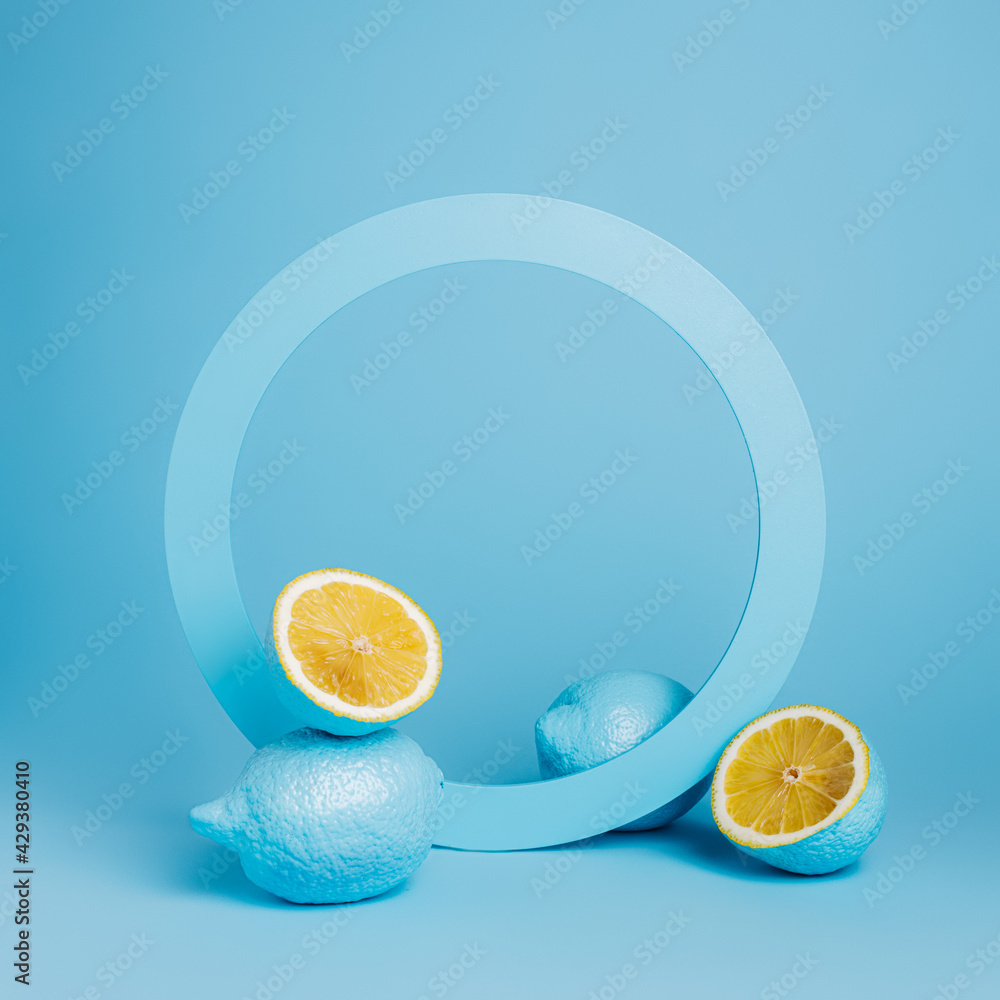 Product podium and frame for copy space with blue lemons on blue ...