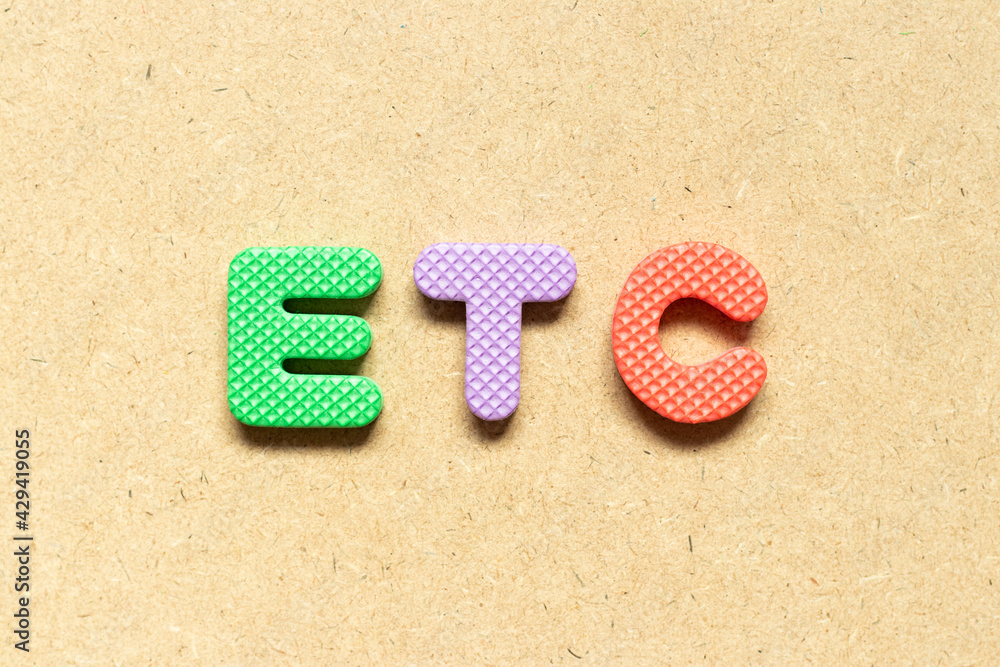 Foam alphabet letter in word etc (abbreviation of et cetera) on wood ...