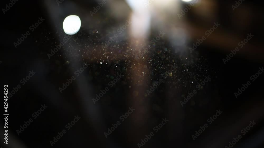 Beautiful shine Floating Dust Particles with Flare on Black Background ...