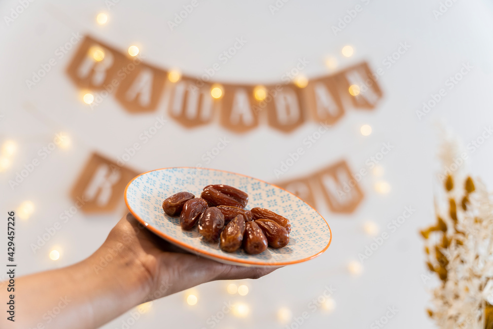 Ramadan dates in front of decorative bunting Stock Photo | Adobe Stock