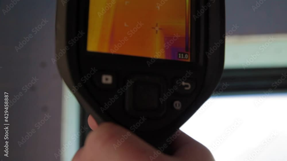 Close up shooting of a thermal imaging camera scanning the fixtures of ...