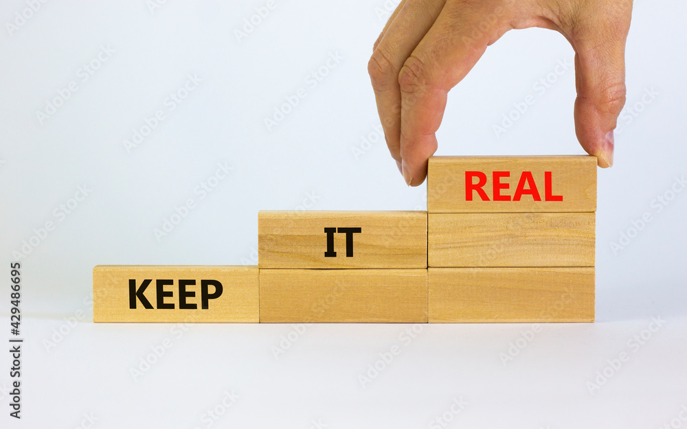 Keep it real symbol. Businessman placing a blocks with word 'keep' on ...
