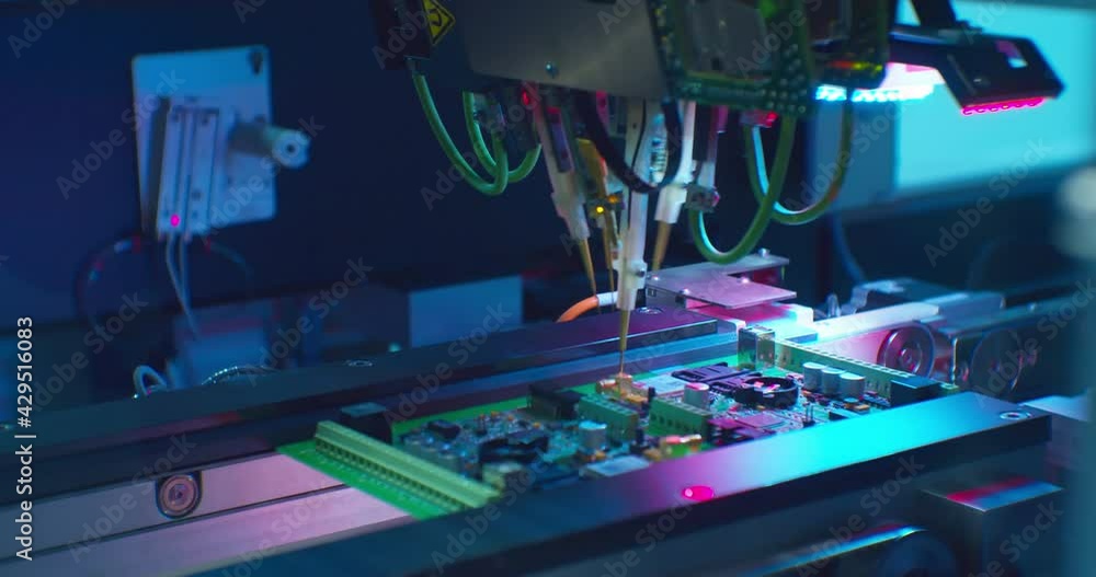Assembly of a complex electronic board by an industrial robot.Modern ...