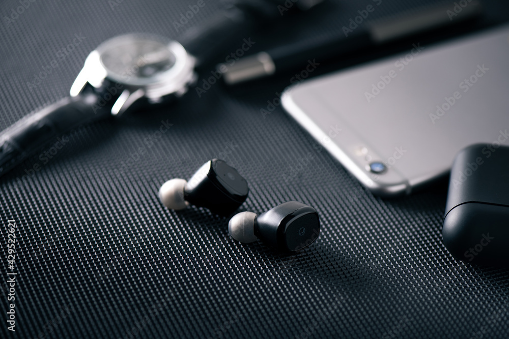 True wireless earbuds Stock Photo | Adobe Stock