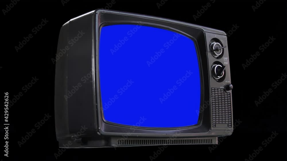 Rotating Old TV with Blue Screen over Black Background. Zoom Into the ...