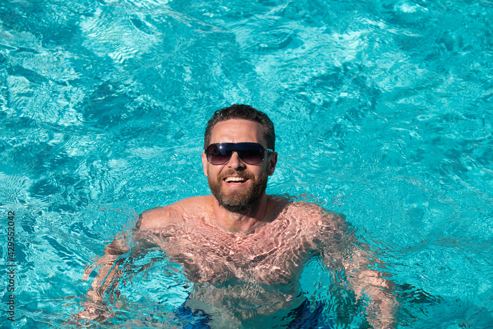 Summer vacation and free time. Handsome man in swimming pool. Pool ...