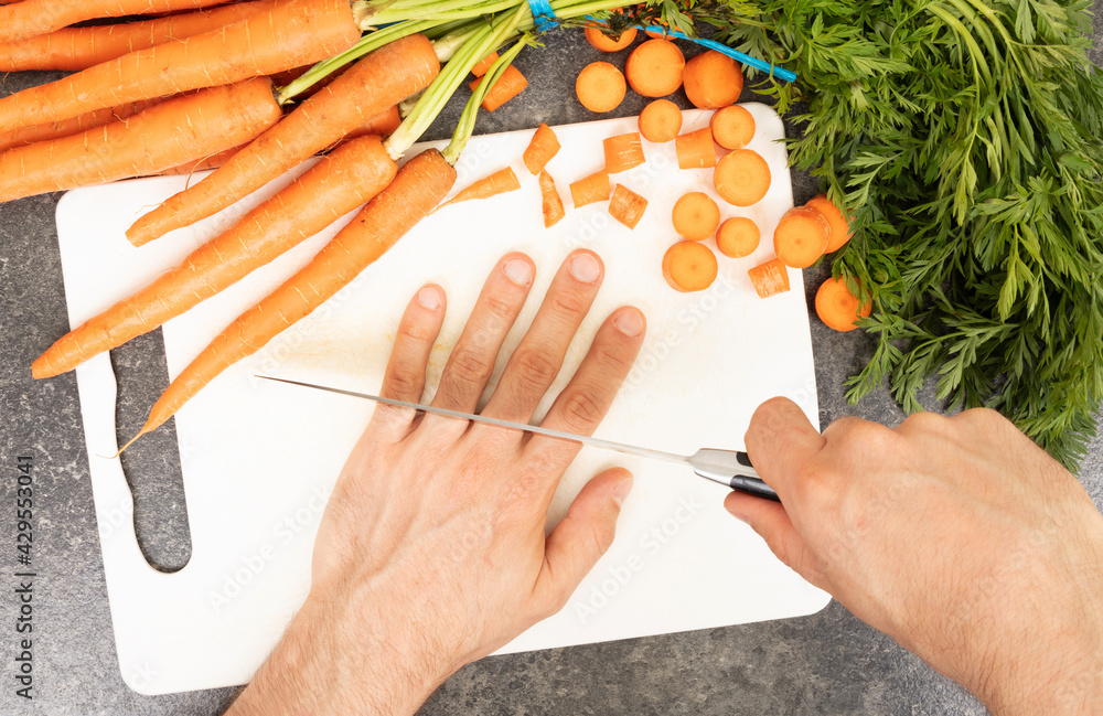 Cutting fingers with a knife Stock Photo | Adobe Stock