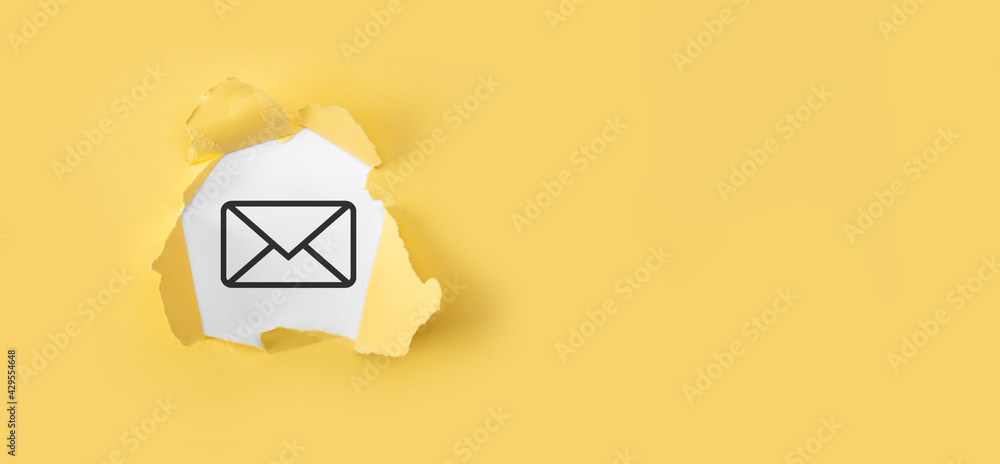 Torn yellow paper with letter email icon on white background.Email ...