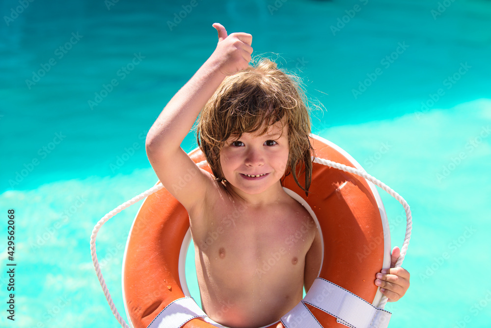 Kid lifeguard show thumb up, ok. Kids summer holidays. Happy child ...