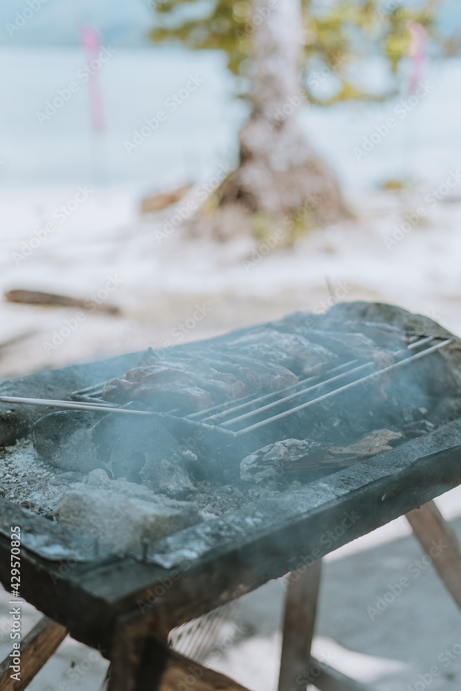 Delicious Shot of a Juicy Grilled Pork Barbecue at the Beach. Cooking ...