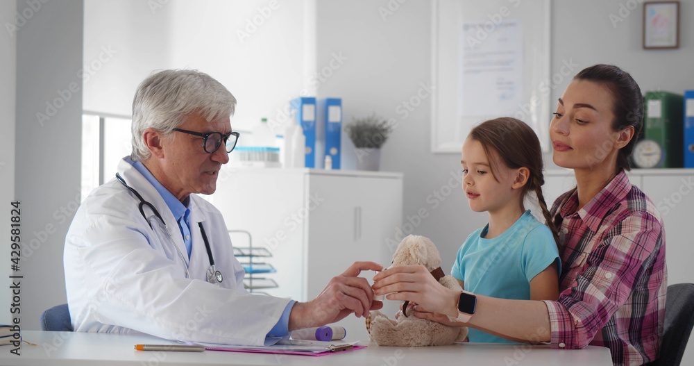 Little girl having medical examination by pediatrician Stock Photo ...
