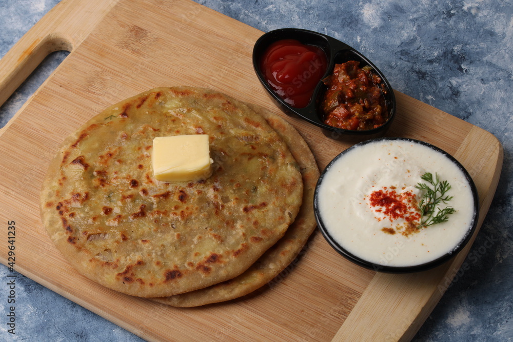 Traditional Indian food Aloo paratha or potato stuffed flat bread ...