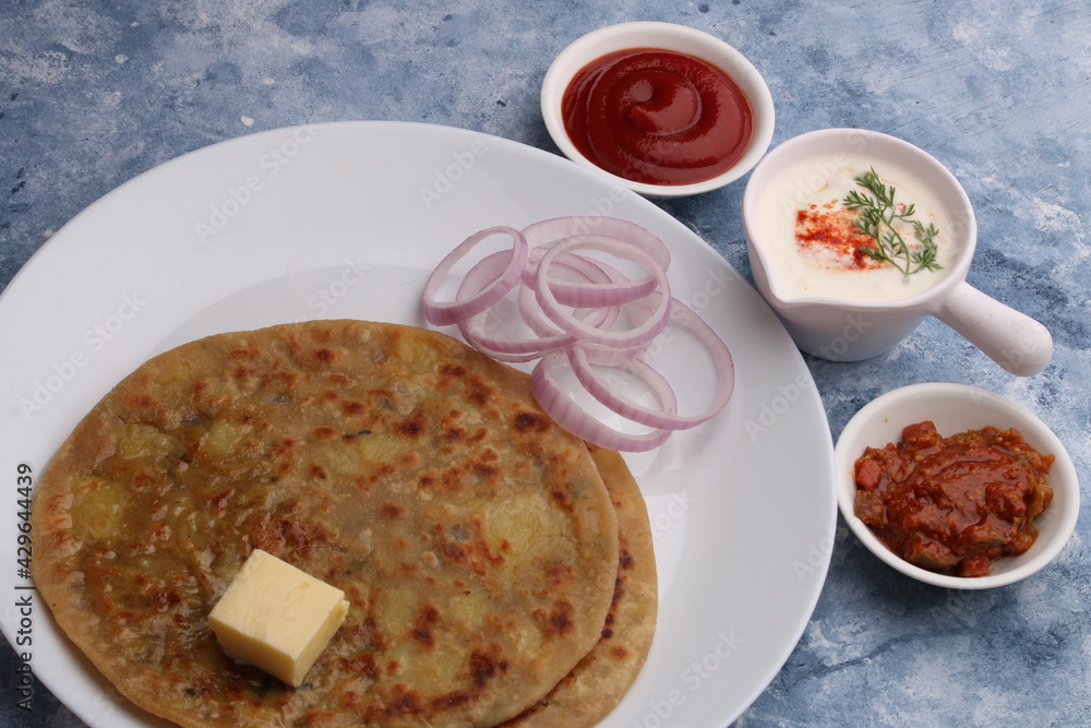 Traditional Indian food Aloo paratha or potato stuffed flat bread ...