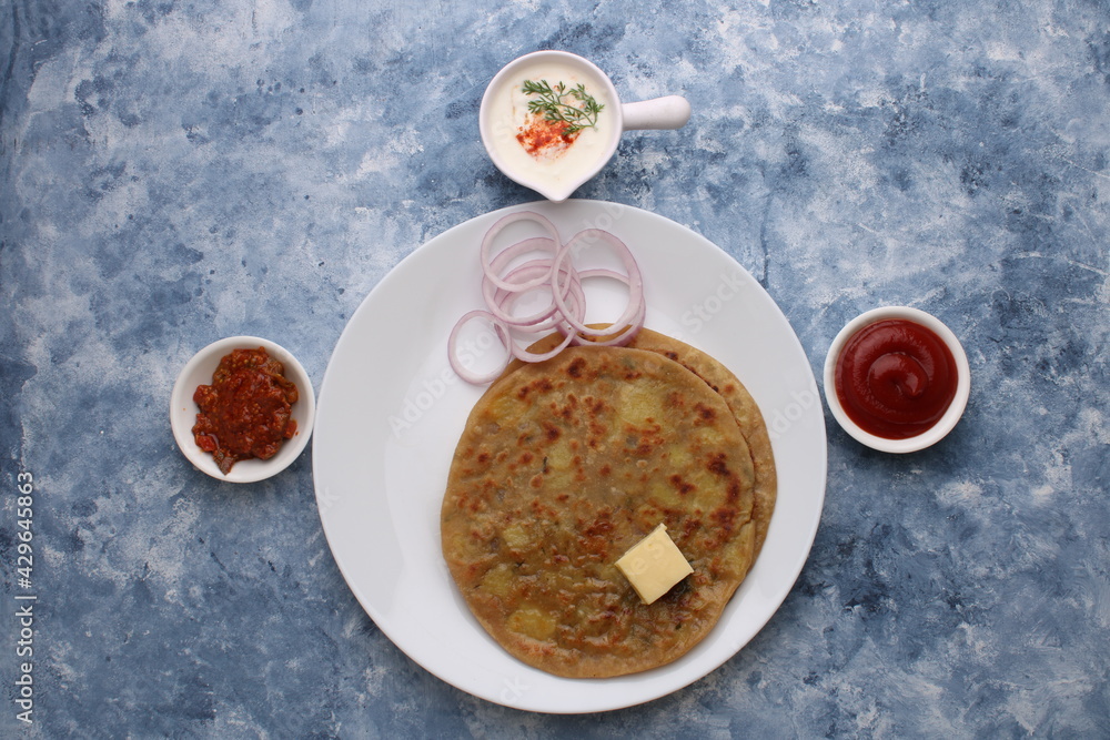 Traditional Indian food Aloo paratha or potato stuffed flat bread ...