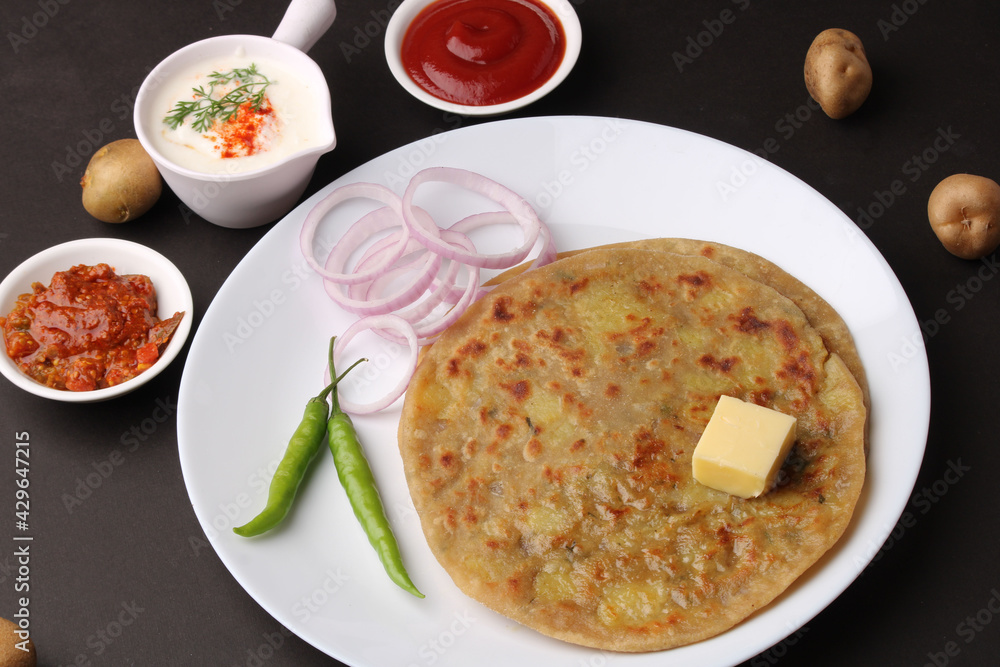 Traditional Indian food Aloo paratha or potato stuffed flat bread ...