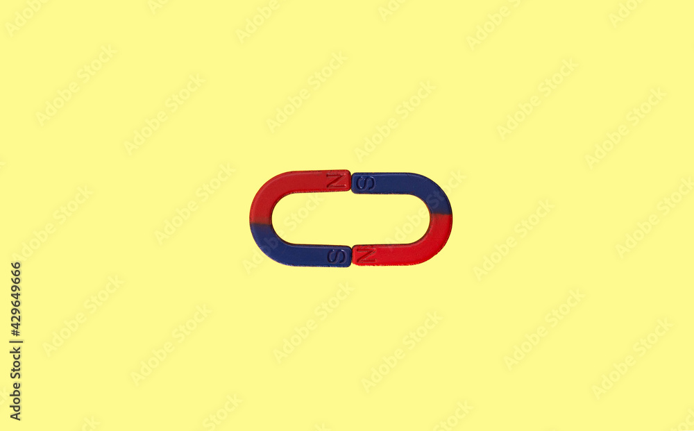two horseshoe-shaped magnets that come together because they are ...