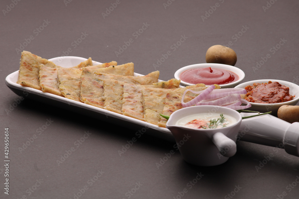 Traditional Indian food Aloo paratha or potato stuffed flat bread ...