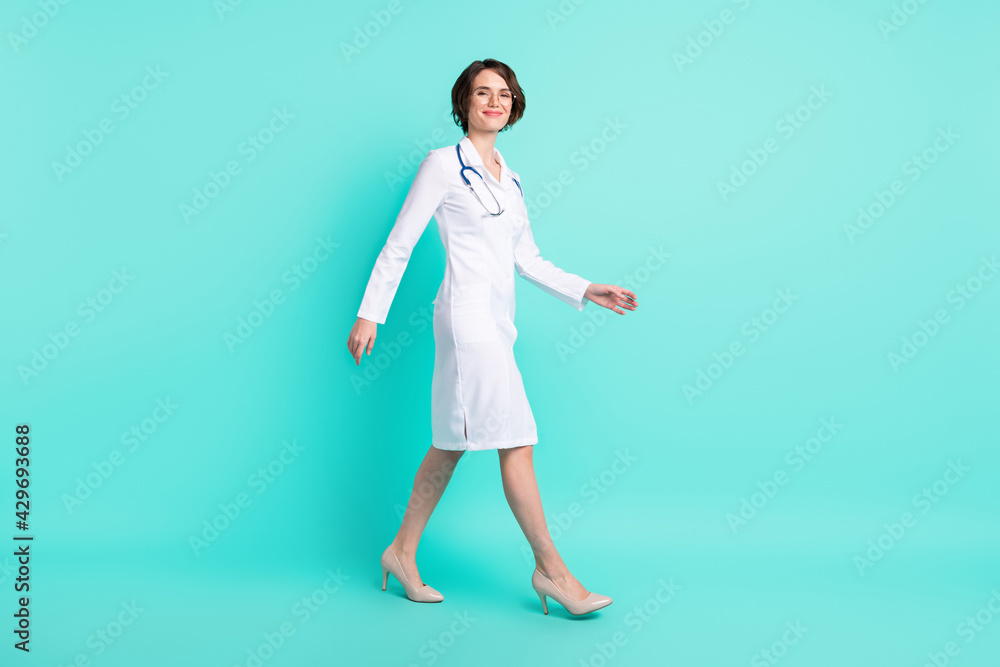 Full length body size side profile photo of nurse smiling going forward ...