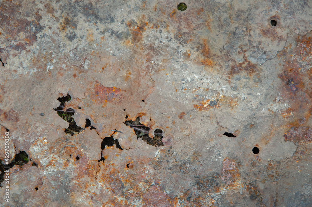 grunge background: rust on an old painted metal surface, holes from ...
