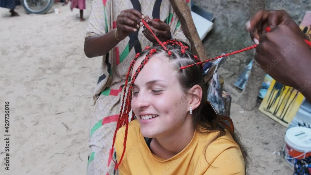Black African woman weaving African-American small braids to beautiful ...