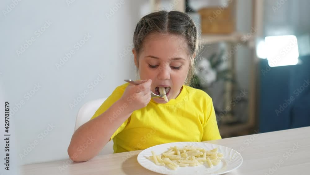 child eating pasta. healthy a food vegetarianism concept. girl child at ...