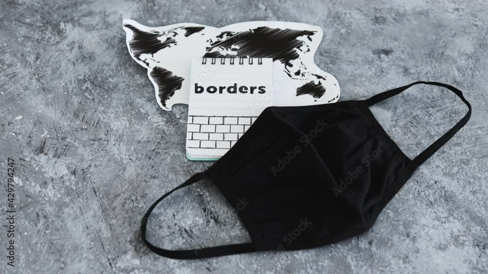 world map with face mask on it next to Borders text, travel industry ...