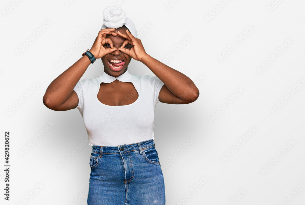 Young african woman with turban wearing hair turban over isolated ...