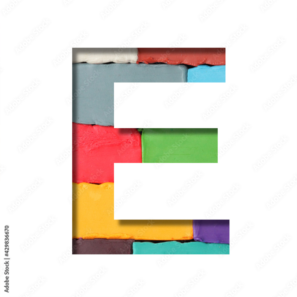 Multi-colored plasticine font. Letter E cut out of paper on a ...