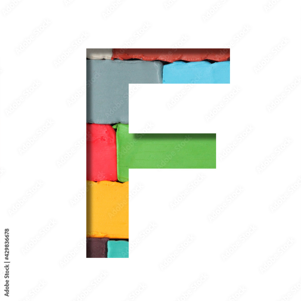 Multi-colored plasticine font. Letter F cut out of paper on a ...