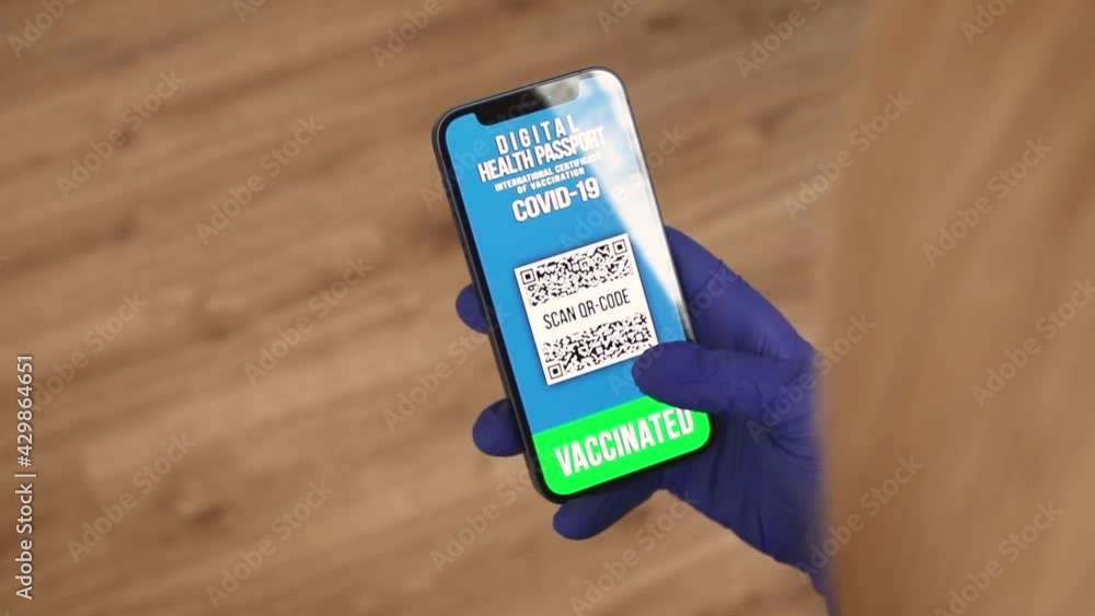 Doctor uses smartphone with digital health passport, coronavirus ...