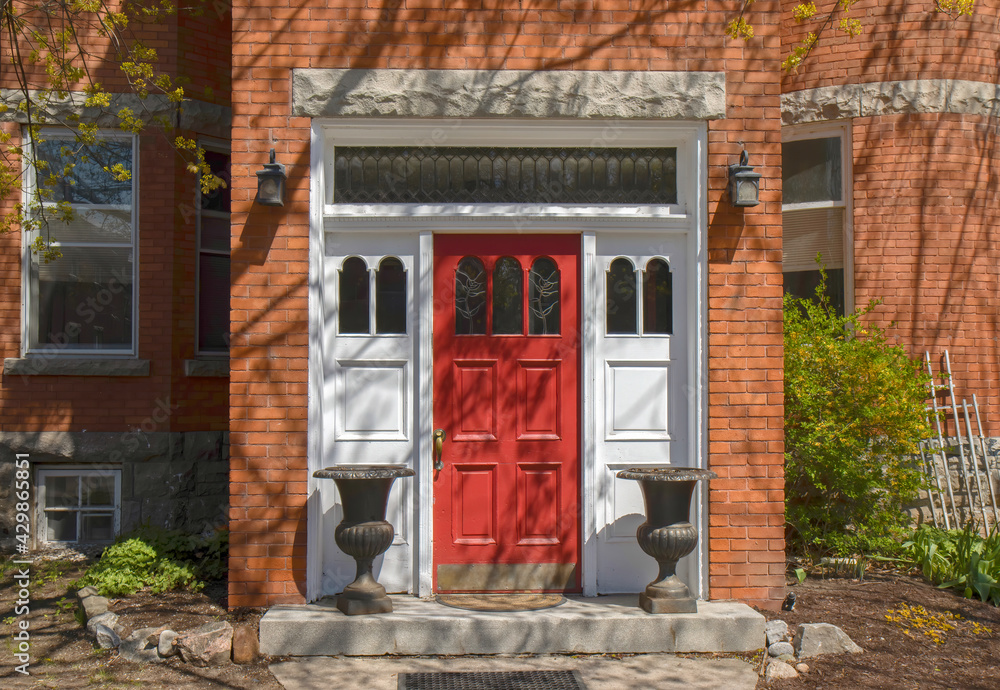 Exterior daytime view of entrance to red brick building showing red ...