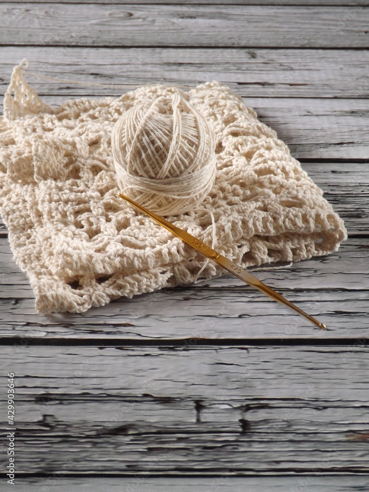 Unfinished crochet project using white yarns as material, following ...