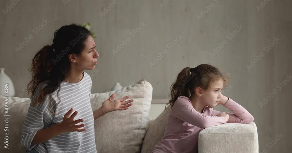 Vidéo Stock Irritated young mother scolds preschool kid girl for bad ...