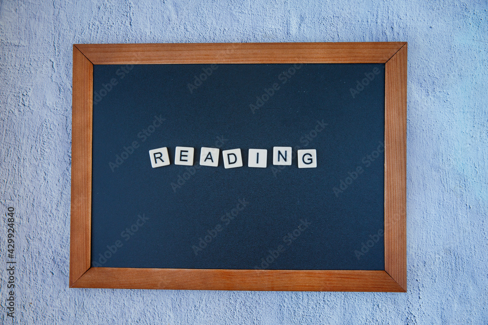 Reading sign of English learning skills written on Blackboard. Chalk ...