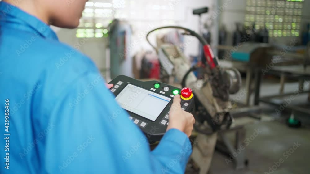 Close up of remote control to control robotic arm machine by engineer ...