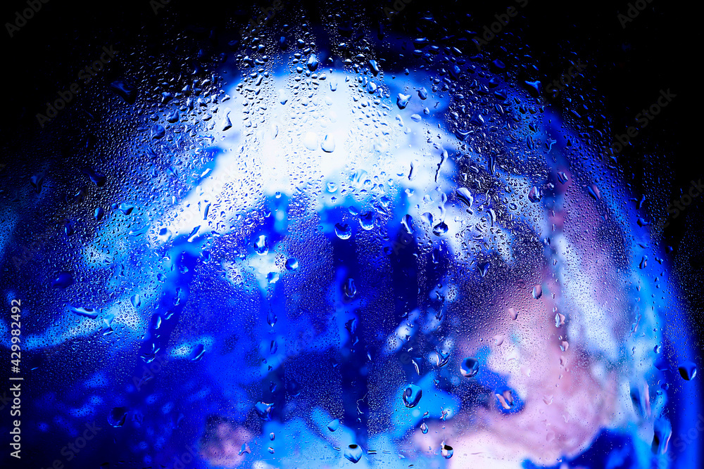 Wet glass on the background of the image of the Earth view from space ...