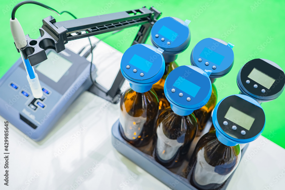 Devices analyzers on glass bottles. Concept - manometric method ...