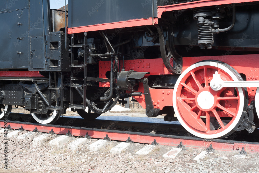Iron wheels of mighty steam locomotives, red iron wheels of steam ...