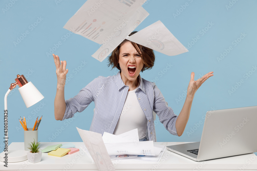 Young angry director employee business woman in casual shirt sit work ...