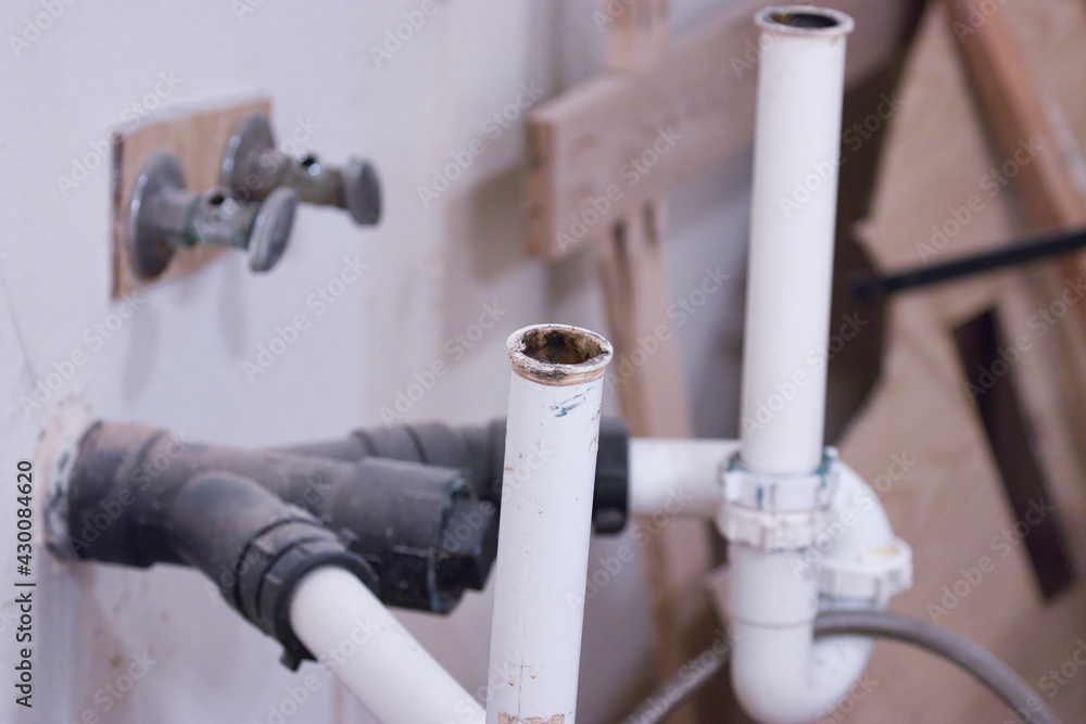 white pvc pipe and water shut off valve for a kitchen sink Stock Photo ...