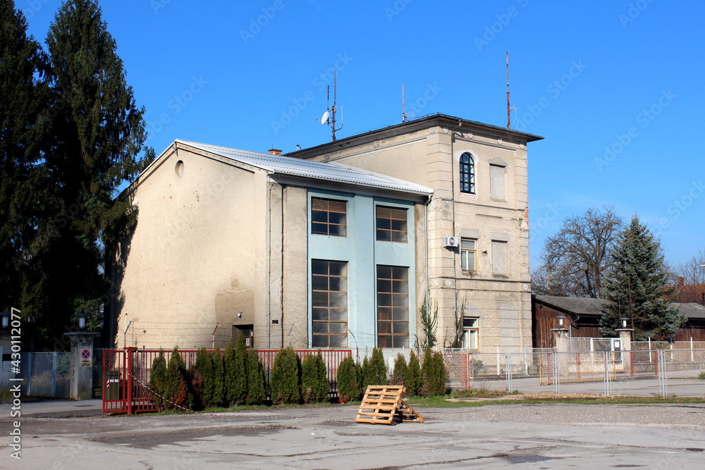 Abandoned unused old industrial building with large windows and ...