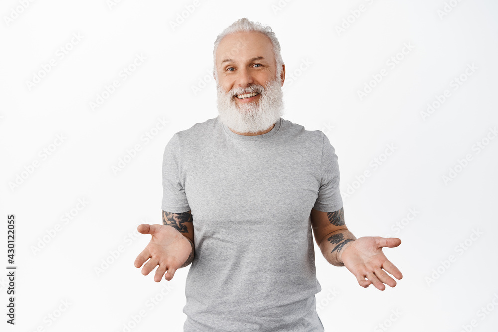 Nothing to say. Smiling unbothered hipster old man spread hands ...