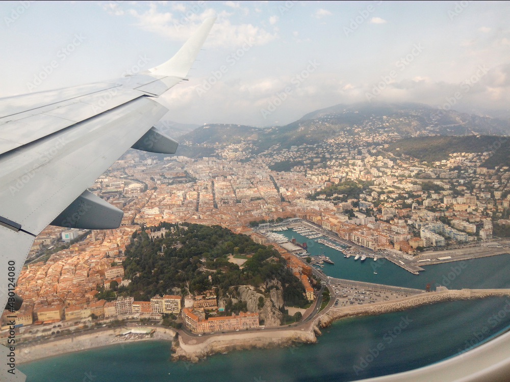 Scenic panoramic view of the city from the plane window. Natural beauty ...