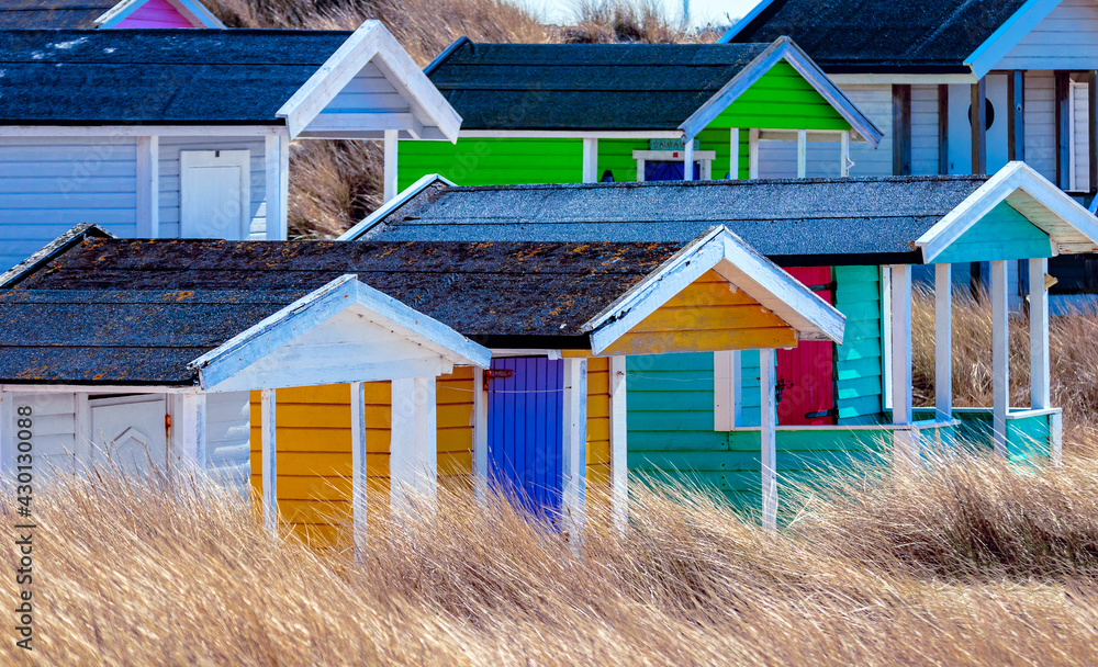 Beach huts, colourful wooden houses on the beach. North Sea, Falsterbo ...